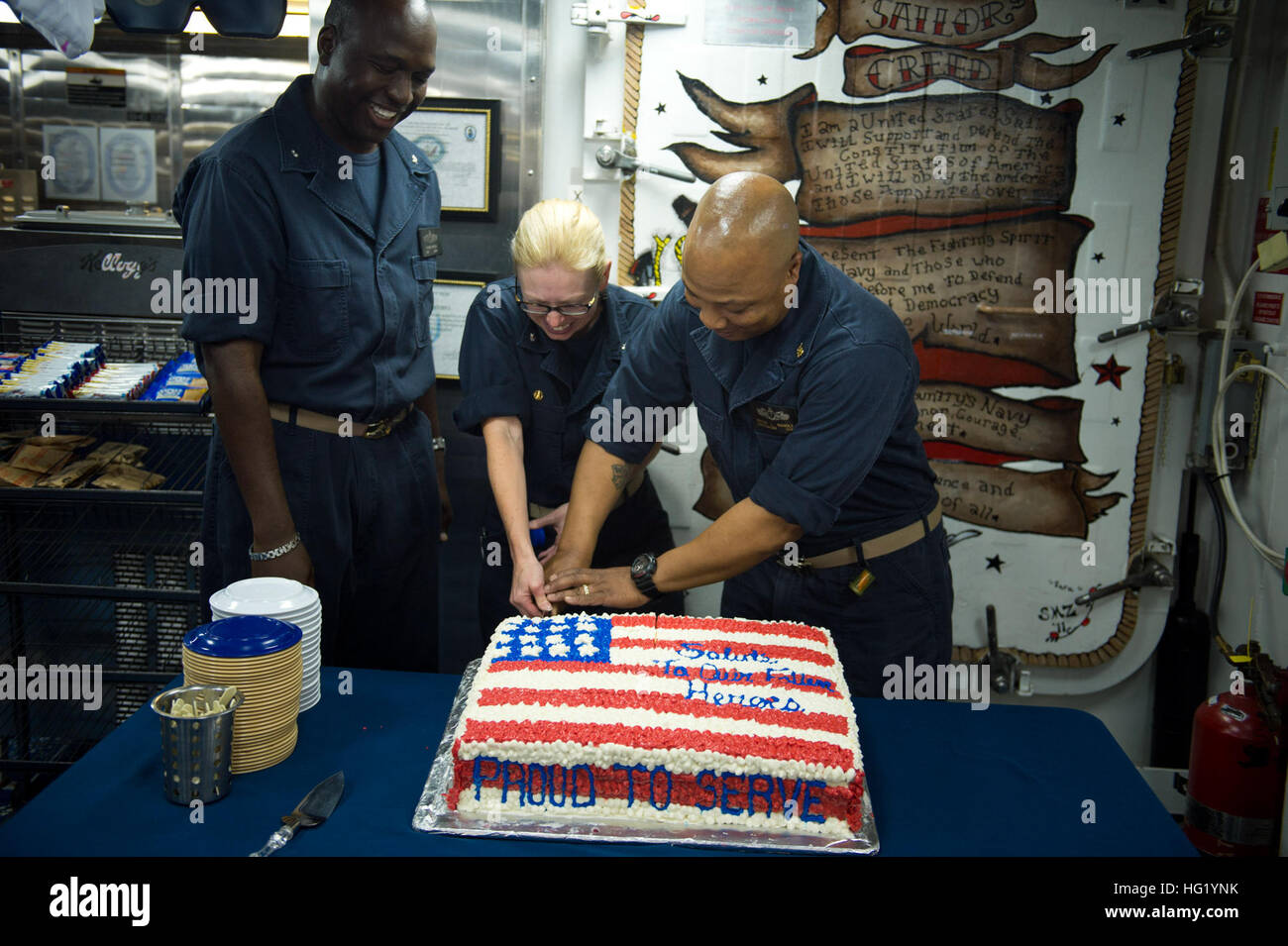 U.S. Navy Cmdr. Camille Flaherty, center, the commanding officer of the ...