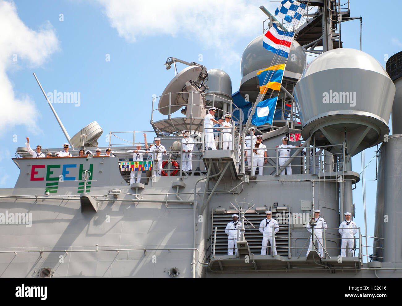 Sailors man the rails aboard the guided-missile cruiser USS Lake Erie ...
