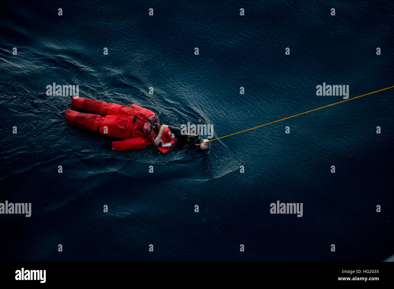 U.S. Navy Lt. j.g. Patrick Spivey, a search and rescue swimmer assigned ...