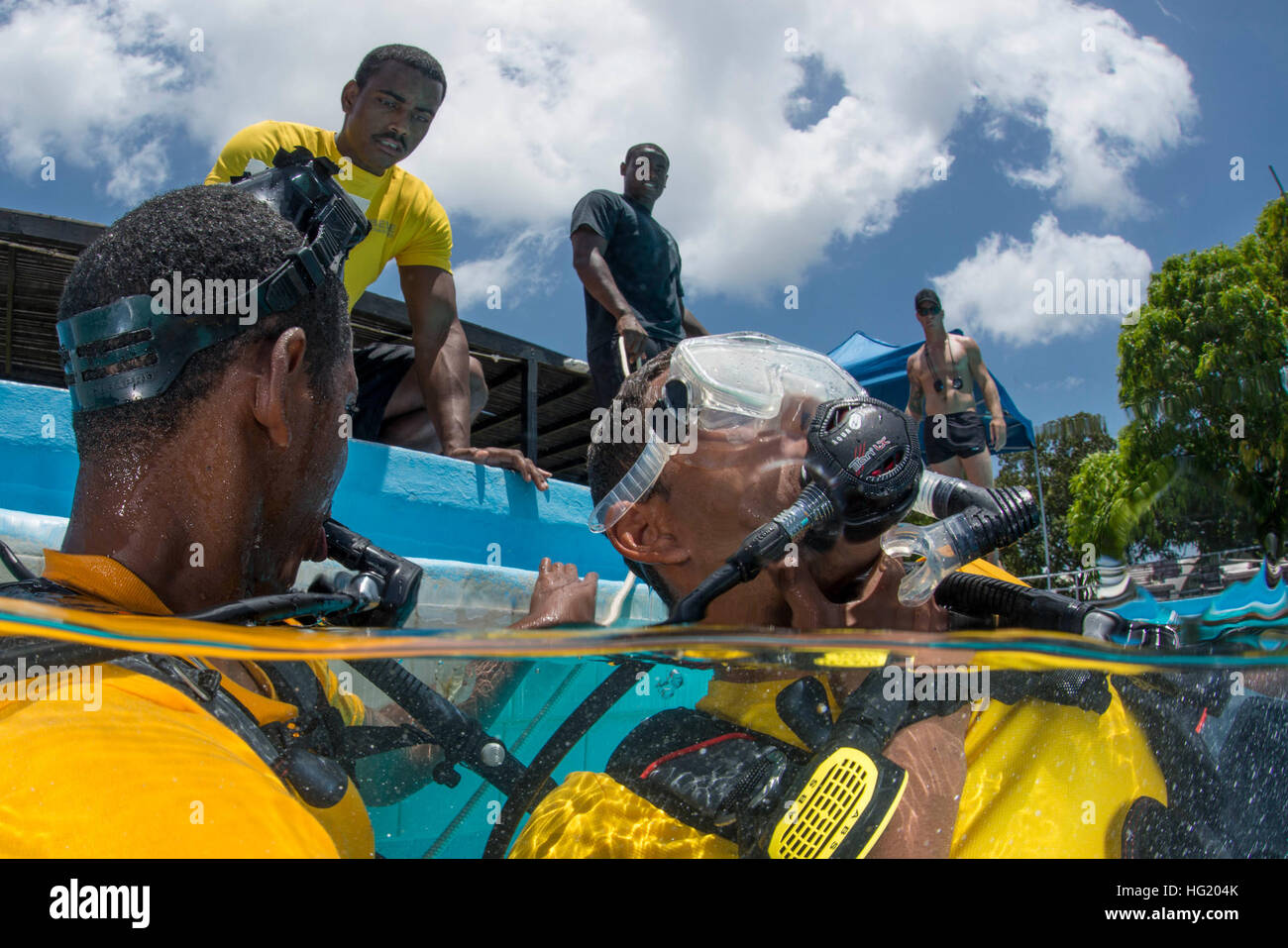 A Belize coast guard divers practice performing emergency procedures ...