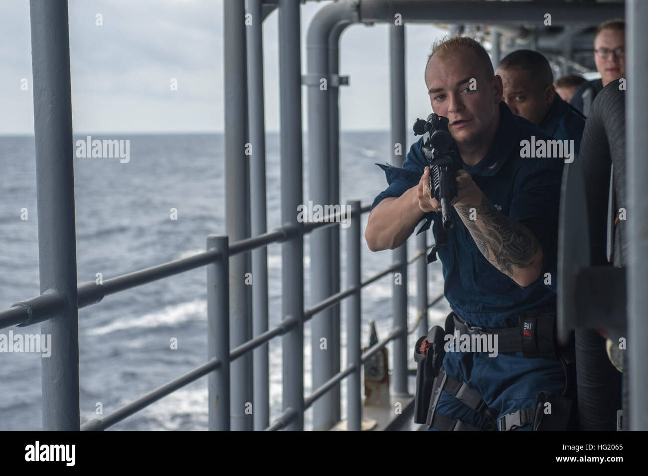 Gunner's Mate 2nd Class Kyle Kloety, from West Bend, Wis., leads the ...