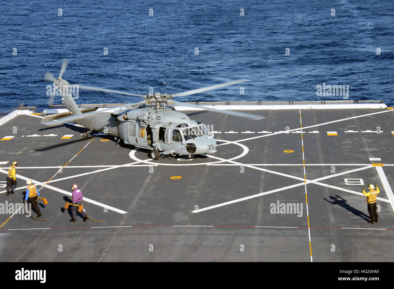 Aviation Boatswains Mate Airman Tyler Bayne directs Sailors aboard ...