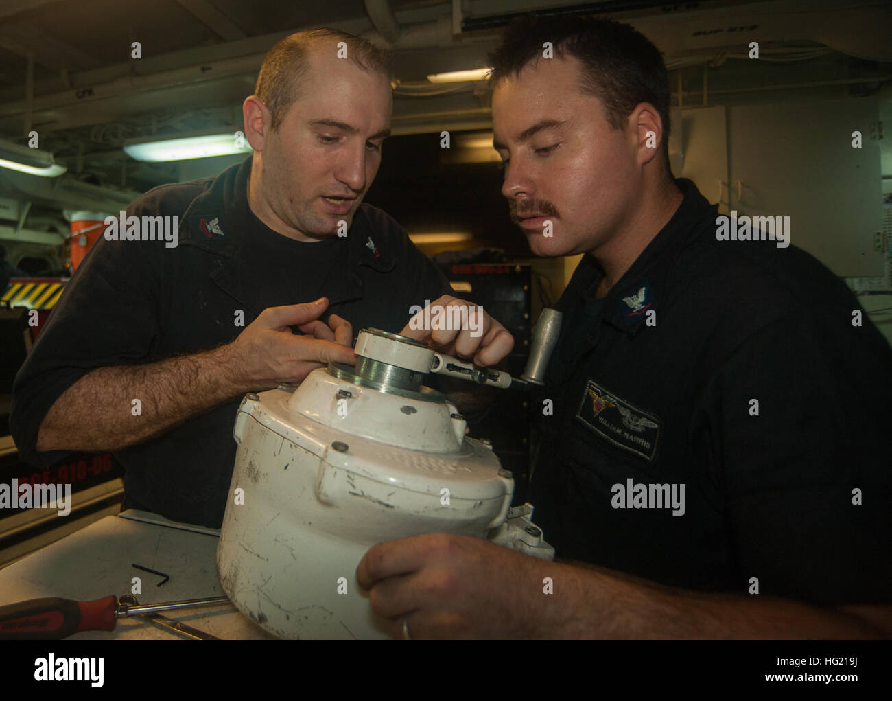 Aviation Support Equipment Technician 2nd Class James Hillman, left ...