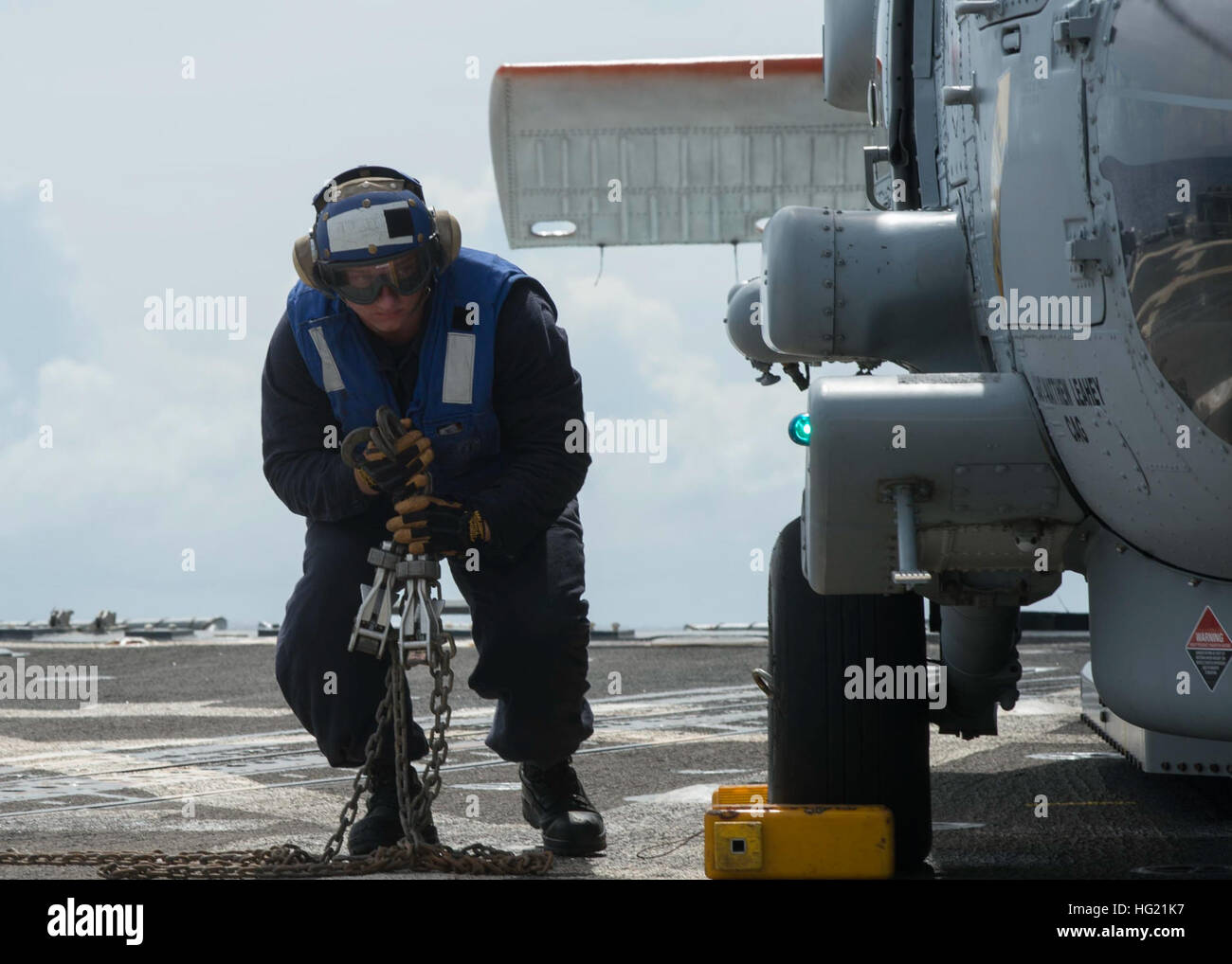 Boatswain’s Mate Seaman Joshua Smitherman, from Mabank, Texas, removes ...
