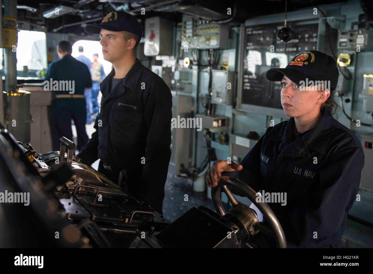 Seamen operate the helm and lee helm aboard Arleigh Burke-class ...