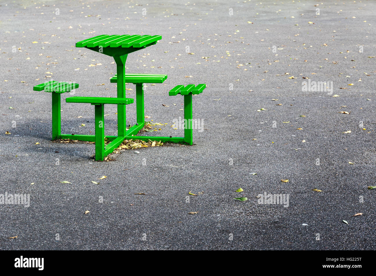Green metal bench table set in a playground Stock Photo - Alamy