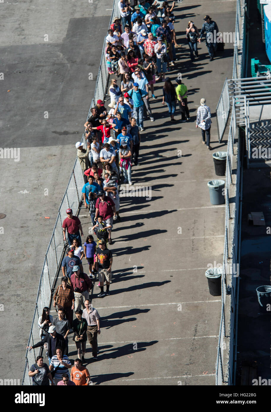Visitors wait in line to tour amphibious assault ship USS America (LHA ...