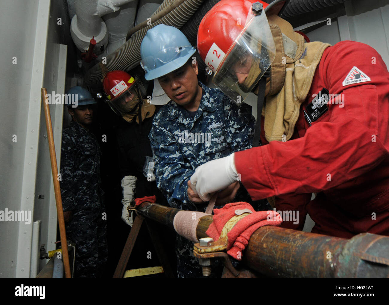 (From left to right) Hull Maintenance Techician 1st Class Michael ...