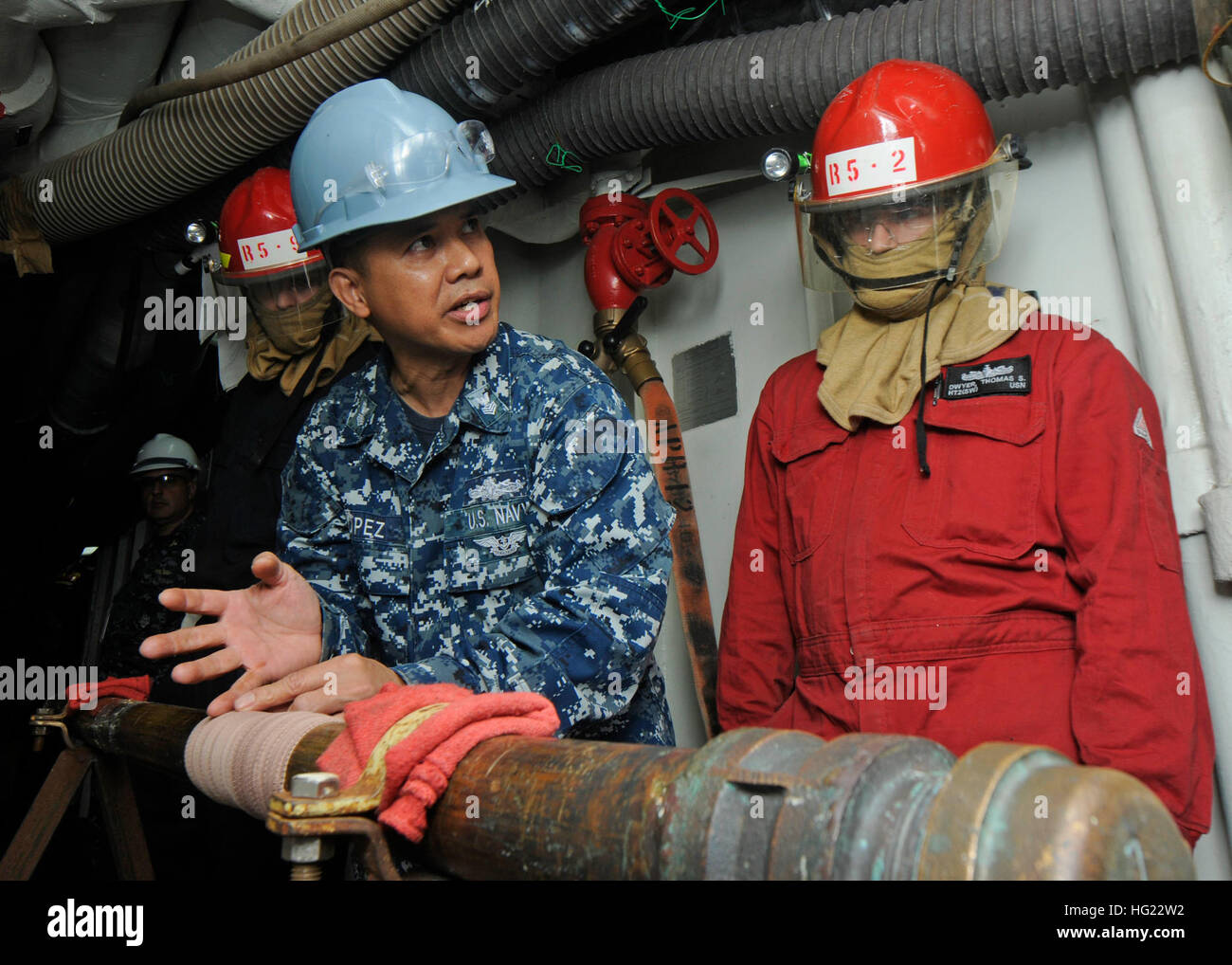 Damage Controlman 1st Class Edwin Lopez, middle, trains Sailors on the ...