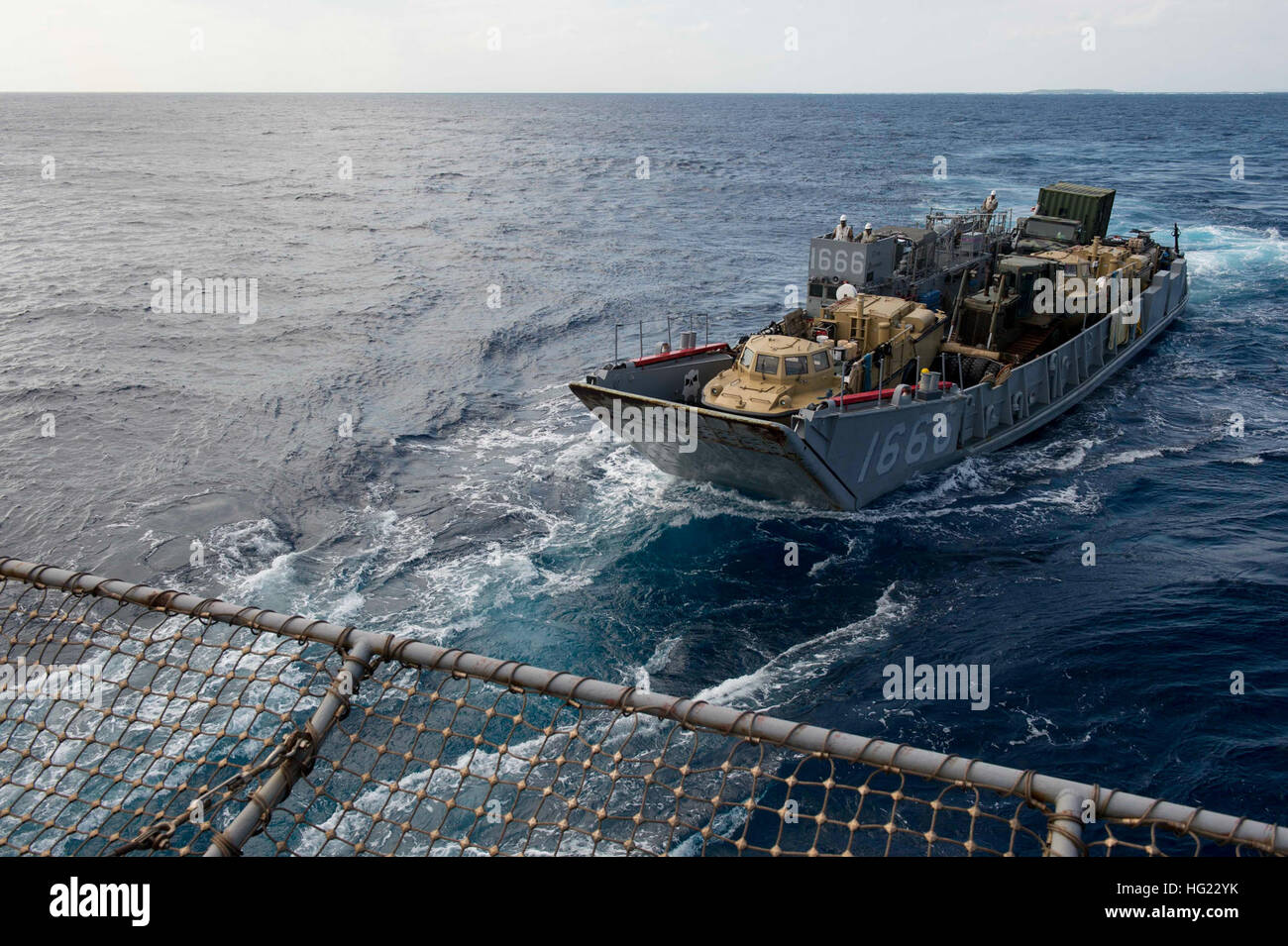 Landing Craft Utility (LCU) 1666, assigned to Naval Beach Unit (NBU) 7, prepares to embark the ...