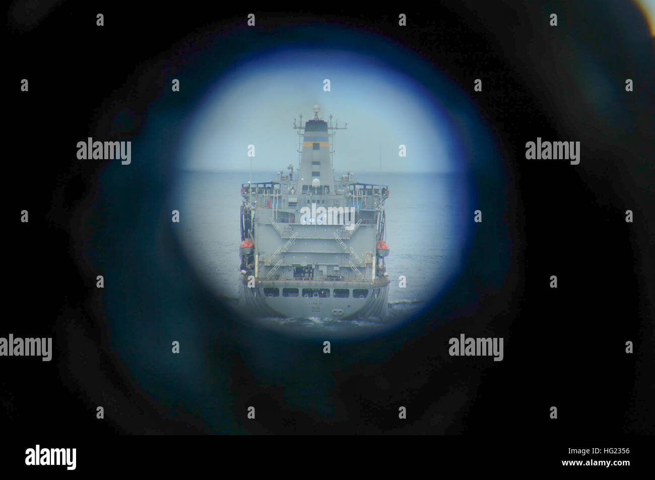 U.S. Naval Ship Pecos (TAO-197) is seen through the “big eyes ...