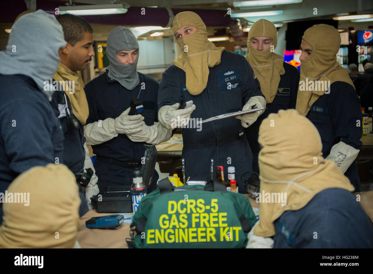 Damage Controlman 2nd Class Milos Sacharzewski, center, explains how to ...