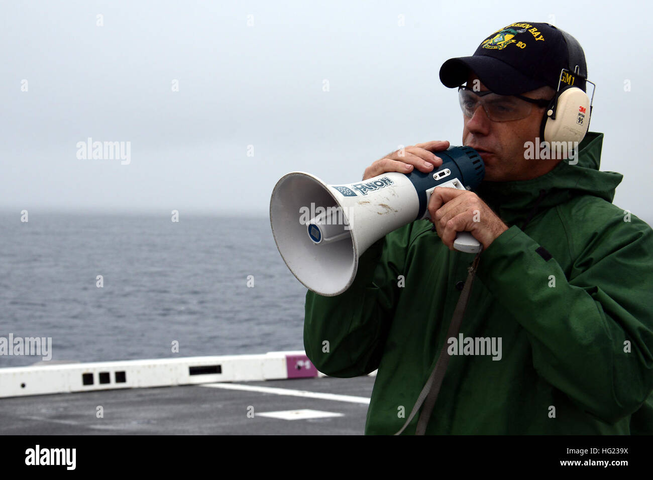 Gunner’s Mate 1st Class Larry Sager instructs shooters during a gun ...
