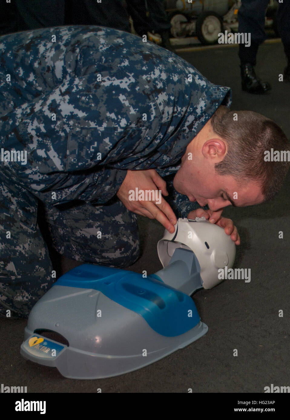 Airman Recruit Peter Flock practices cardiopulmonary resuscitation (CPR ...