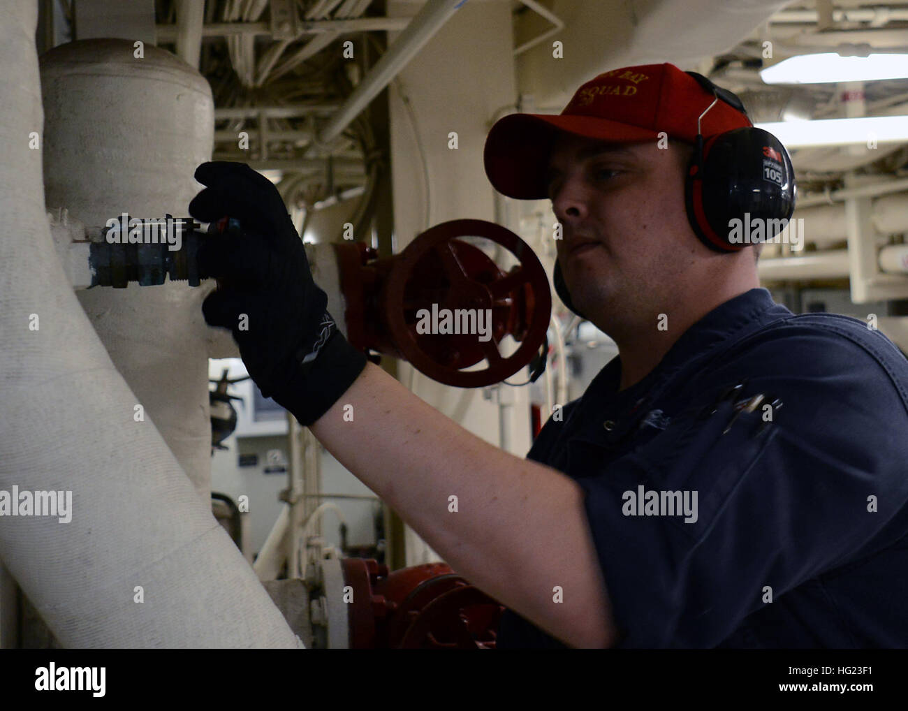 Hull Maintenance Technician 2nd Class Timothy Salyer tests bilge ...
