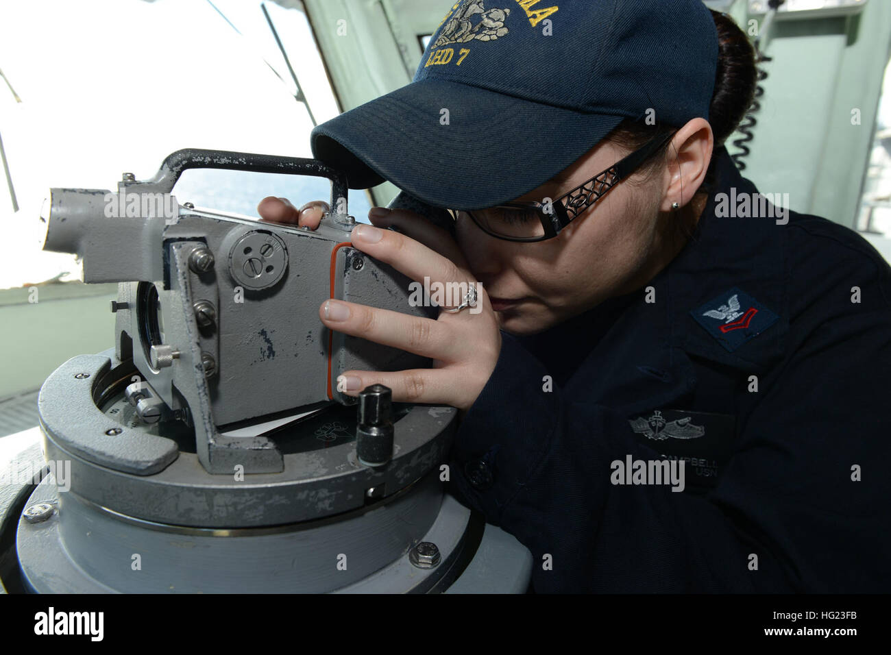 Quartermaster 2nd Class Brandi Campbell looks through a telescopic ...