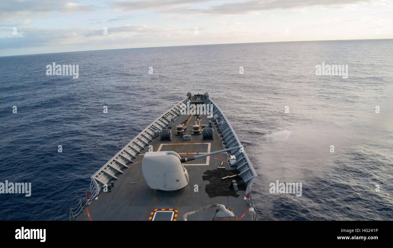 The 5-inch/54-caliber (Mk 45) lightweight gun fires a round off during ...