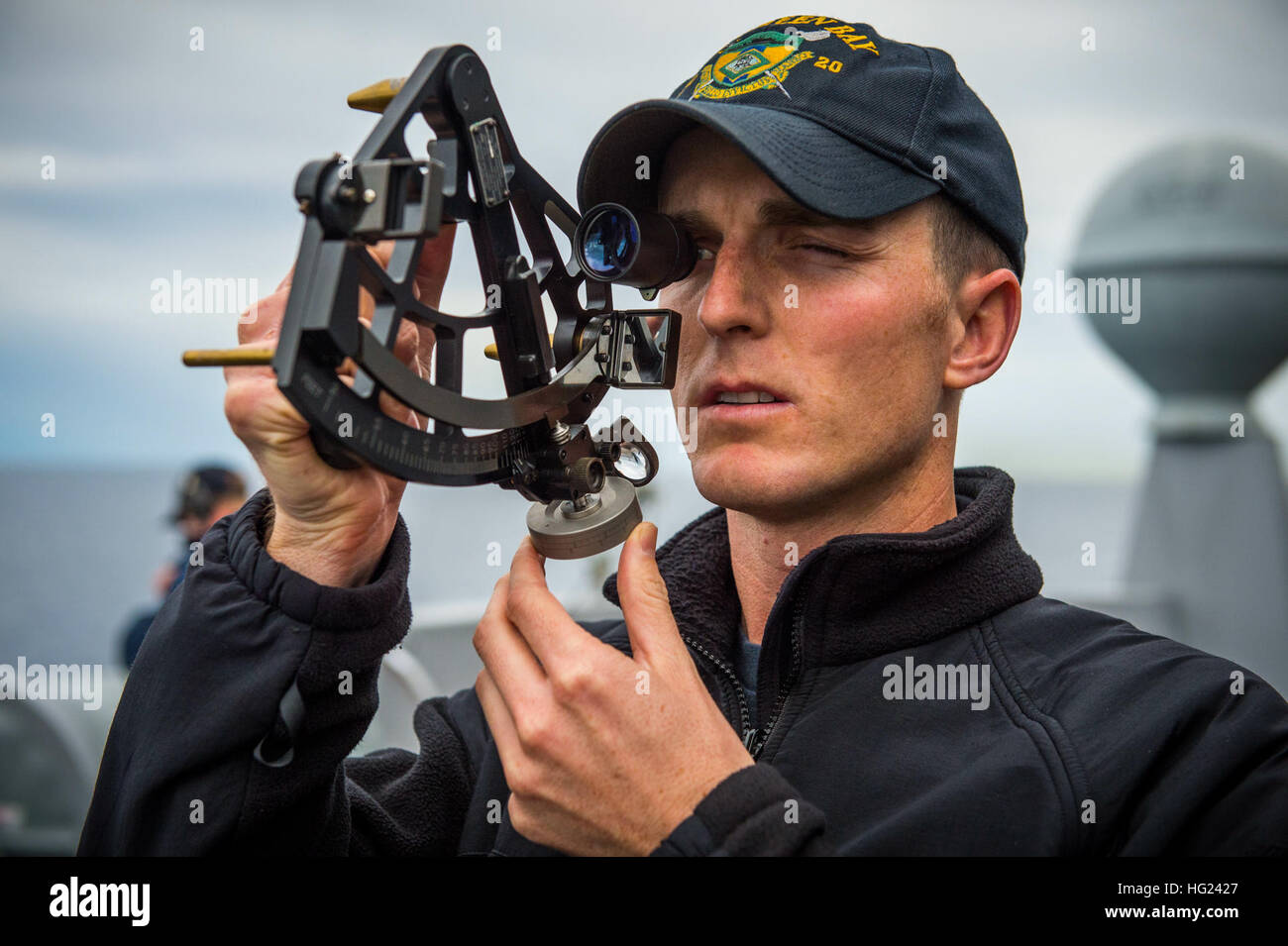 Quartermaster 2nd Class Nicholas Gibson calculates the range of the ...