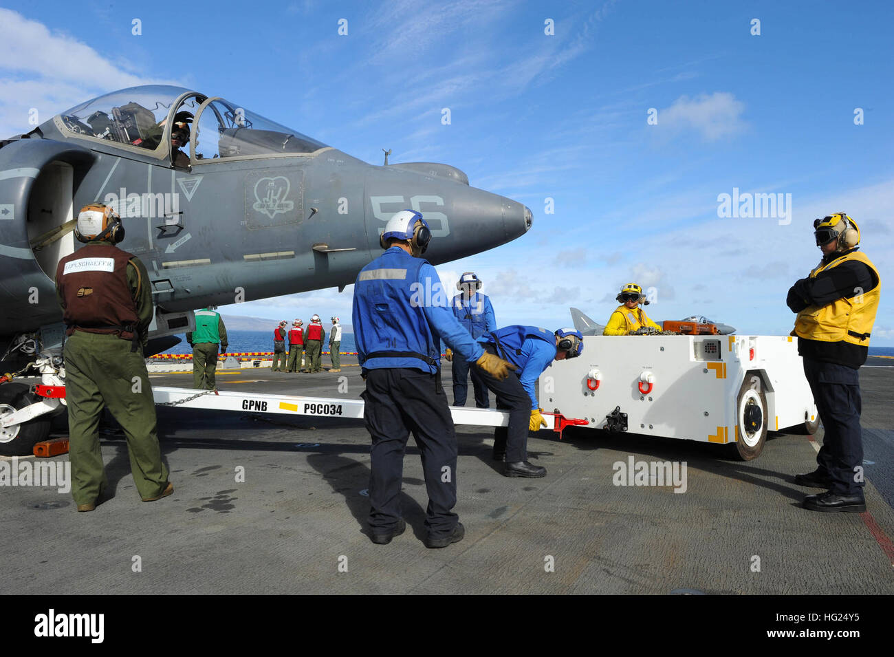 PACIFIC OCEAN (Feb. 28, 2015) Flight deck personnel move an AV-8B ...