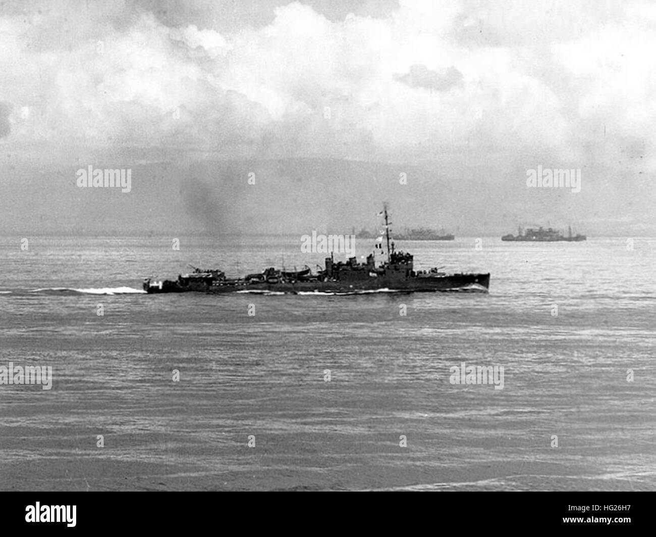 USS Hopkins (DMS-13) steams past the transport area between Guadalcanal ...
