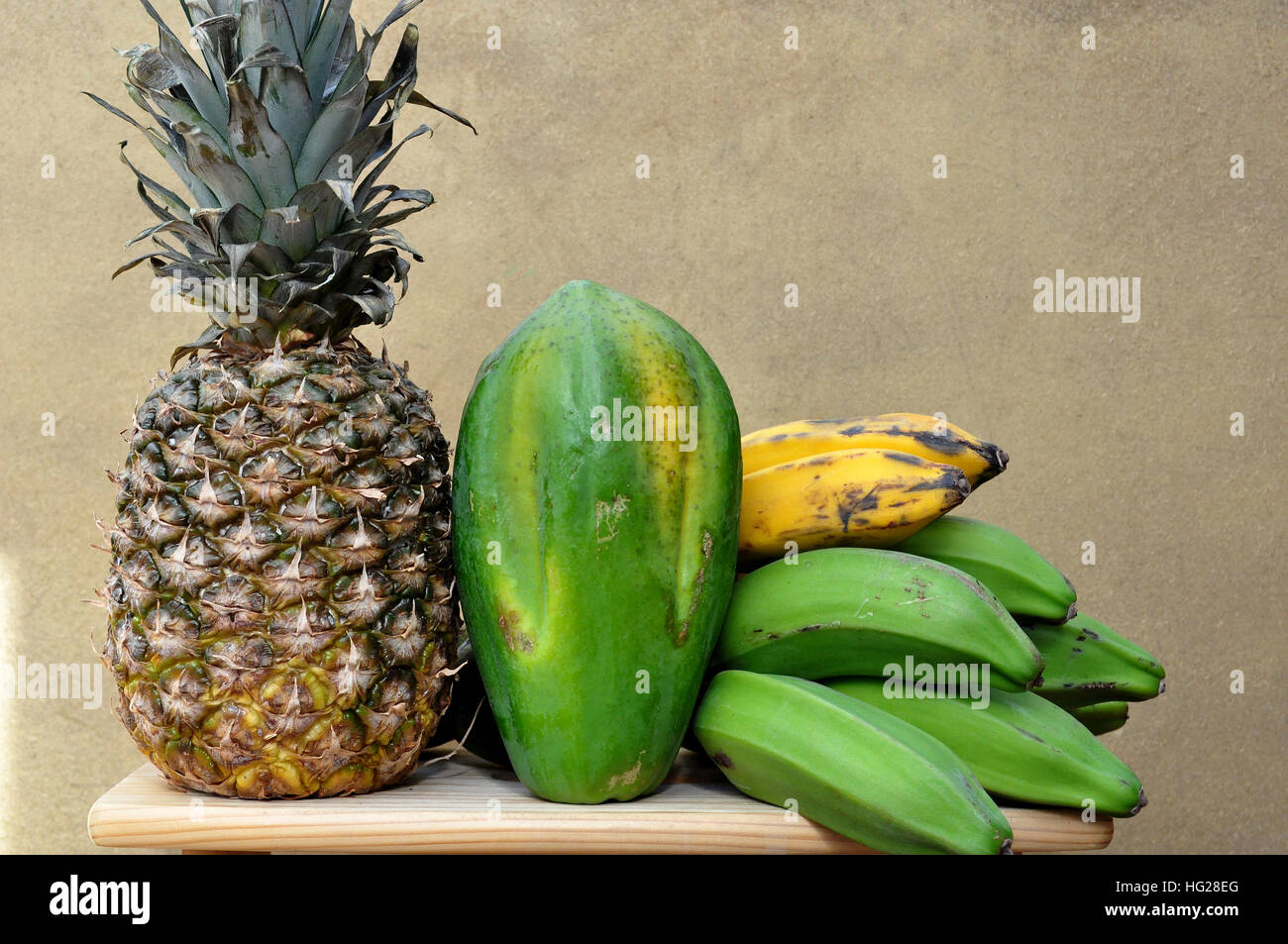 Pineapple, bananas and papaya Stock Photo - Alamy