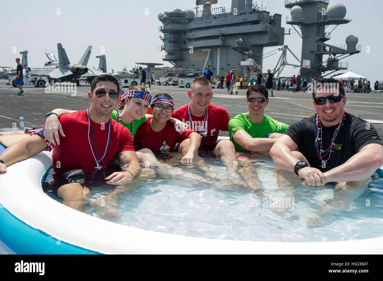 150705-N-KU391-258 ARABIAN GULF (July 05, 2015) – Sailors cool off in a ...
