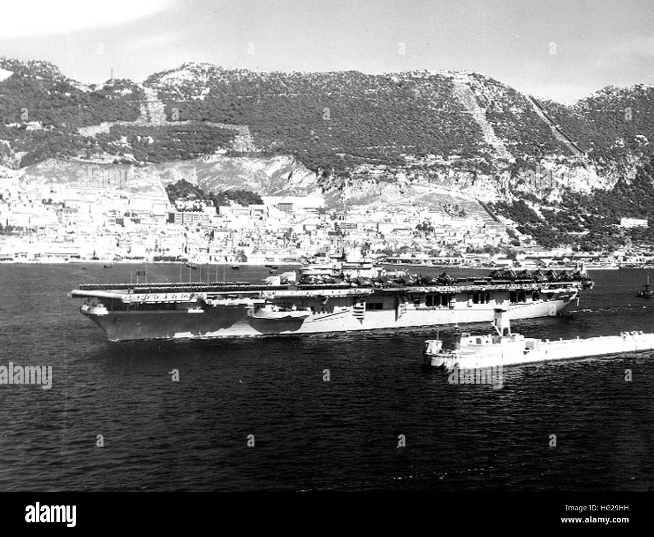 USS Valley Forge (CV-45) steams out of Gibraltar harbor, en route to ...