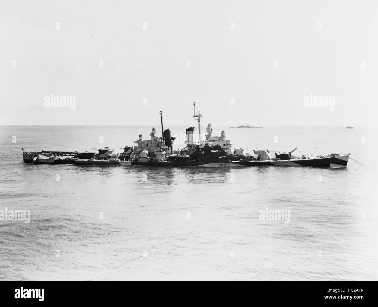 USS Houston (CL-81) under tow on 17 October 1944, after she had been ...