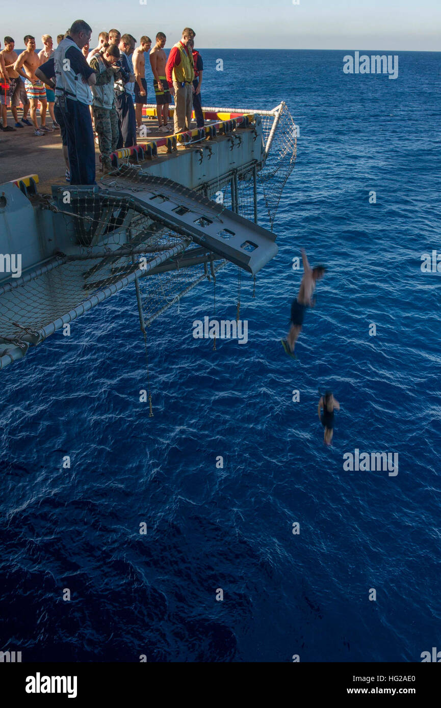 Sailors jump off aircraft elevator hi-res stock photography and images ...
