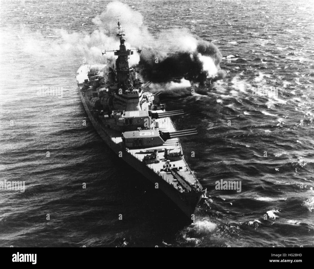 USS Iowa (BB-61) firing her 406 mm guns at North Korean coastal ...