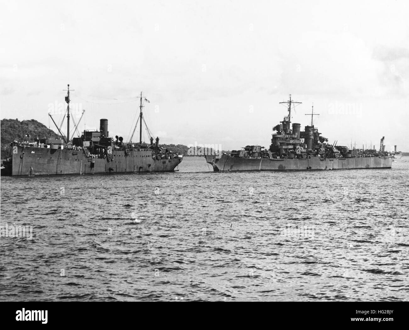 USS St. Louis (CL-49) comes alongside USS Vestal (AR-4) at Tulagi in ...