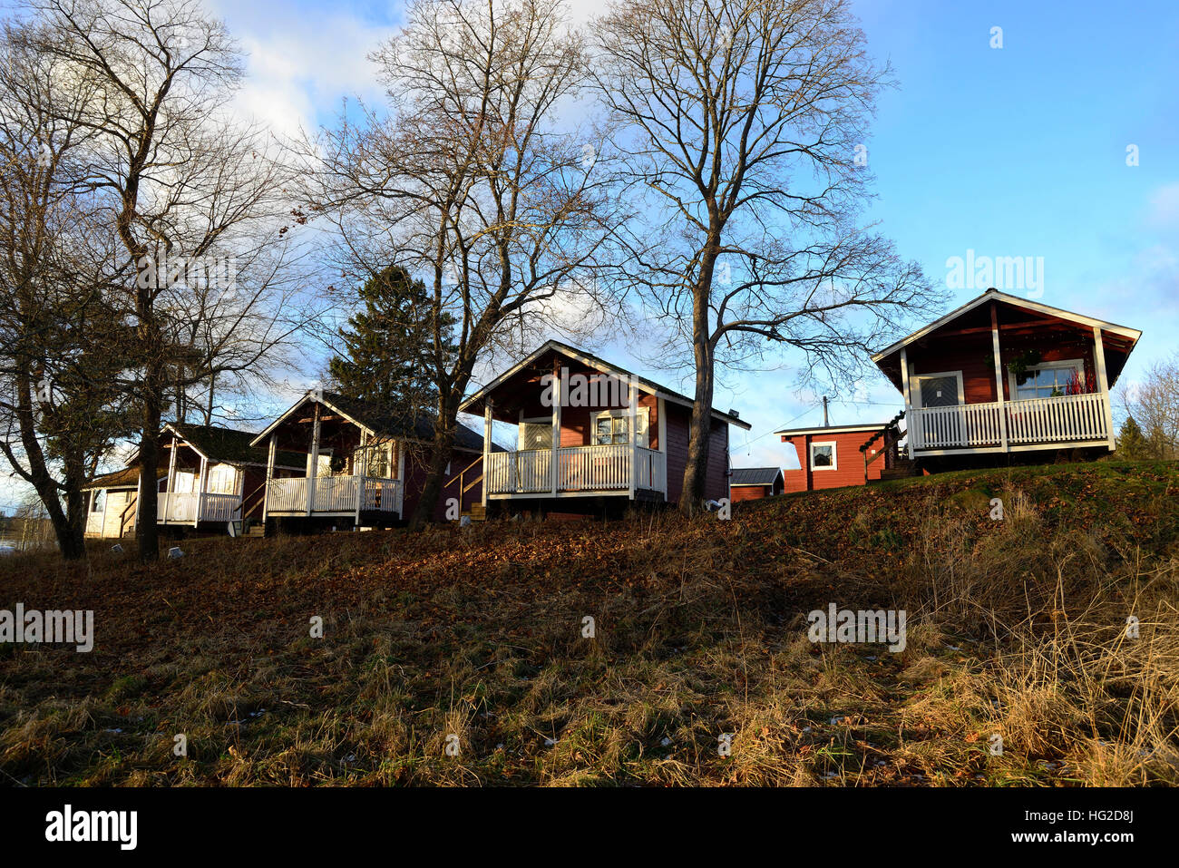 row wooden summer houses in the autumn, Finland Stock Photo - Alamy