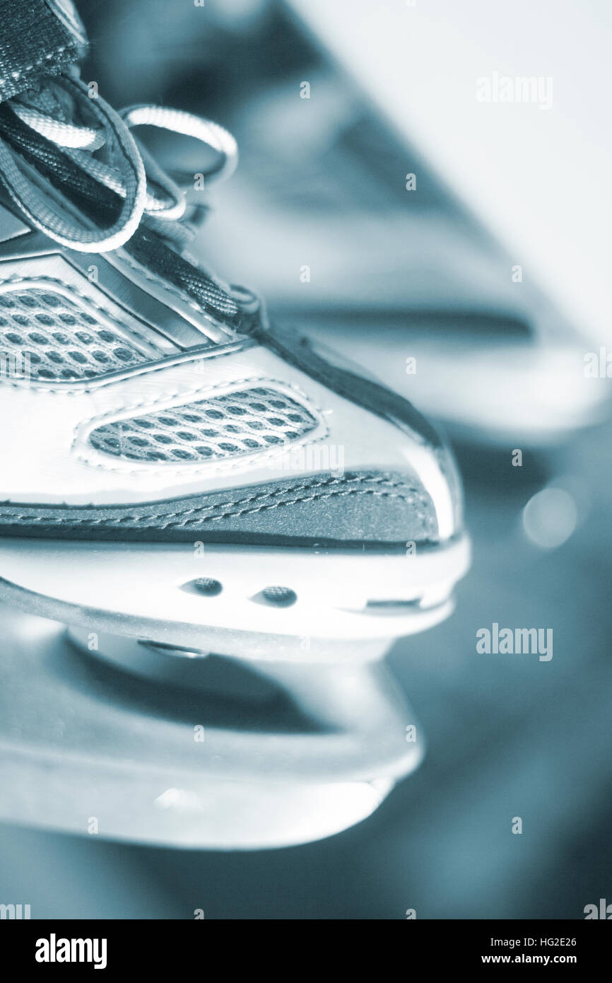 Ice skates in skate store shop window on display on sale for skating on ...