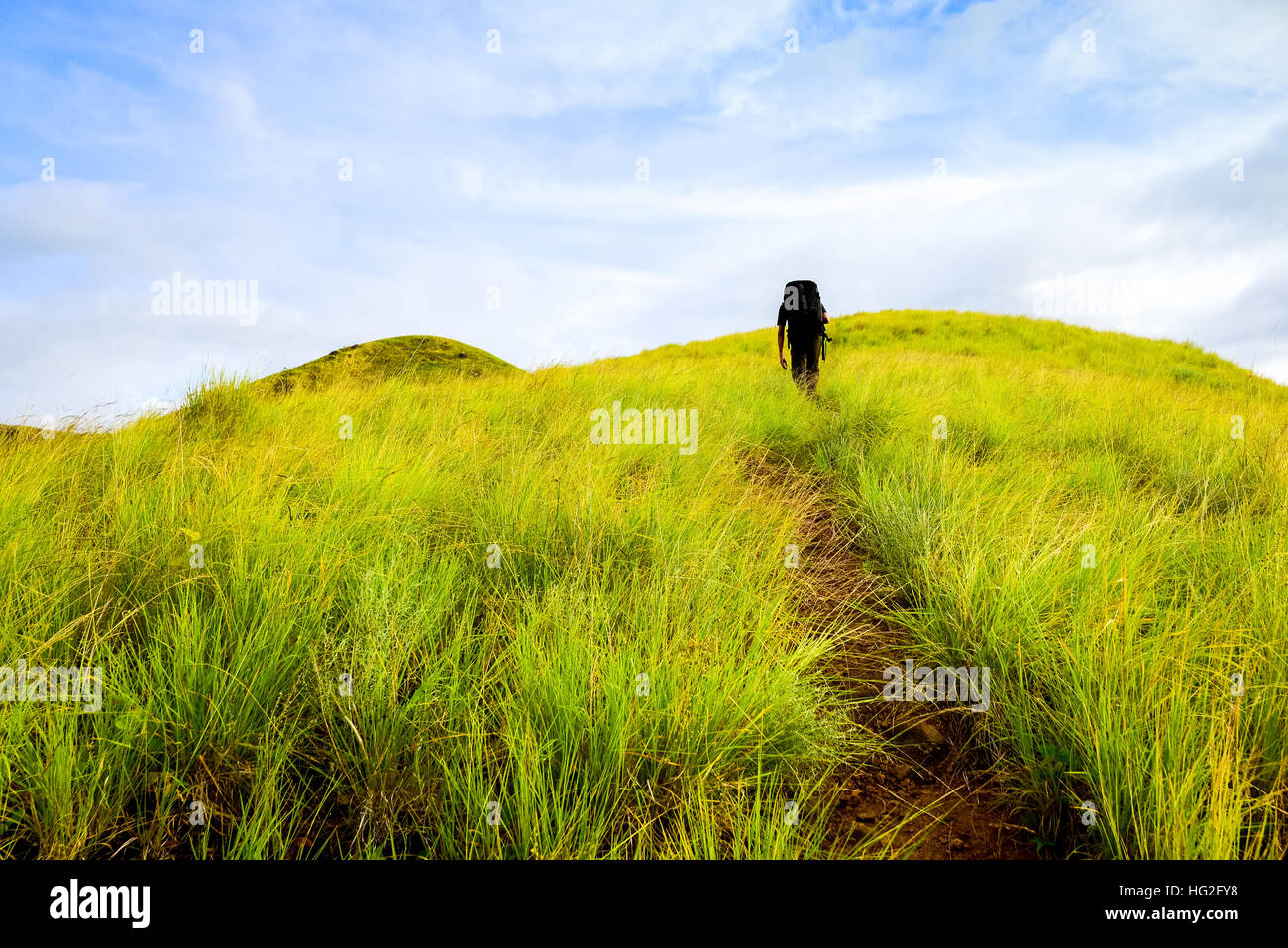 Man climbing hill hi-res stock photography and images - Alamy
