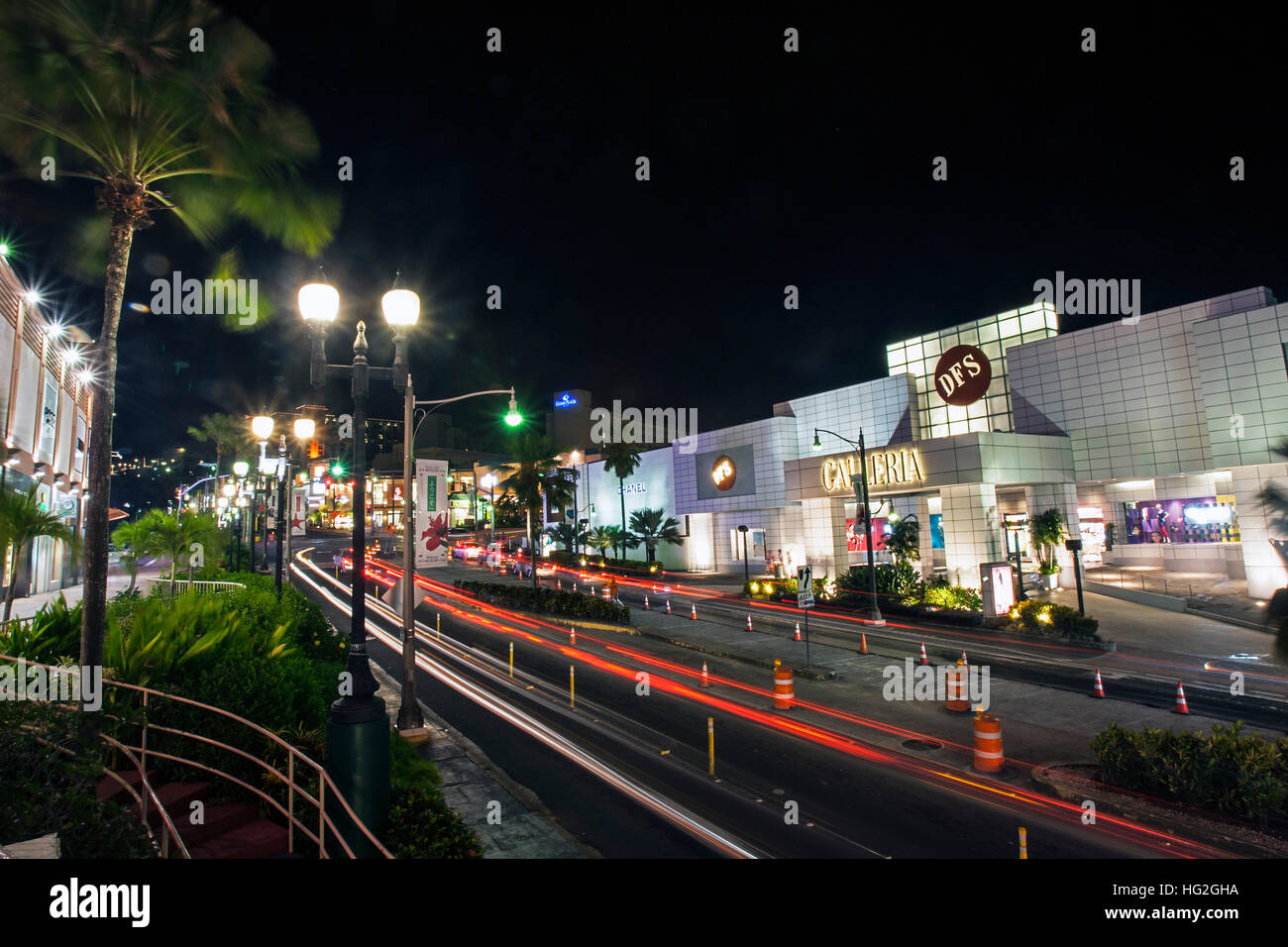 Shops at night Guam Stock Photo - Alamy