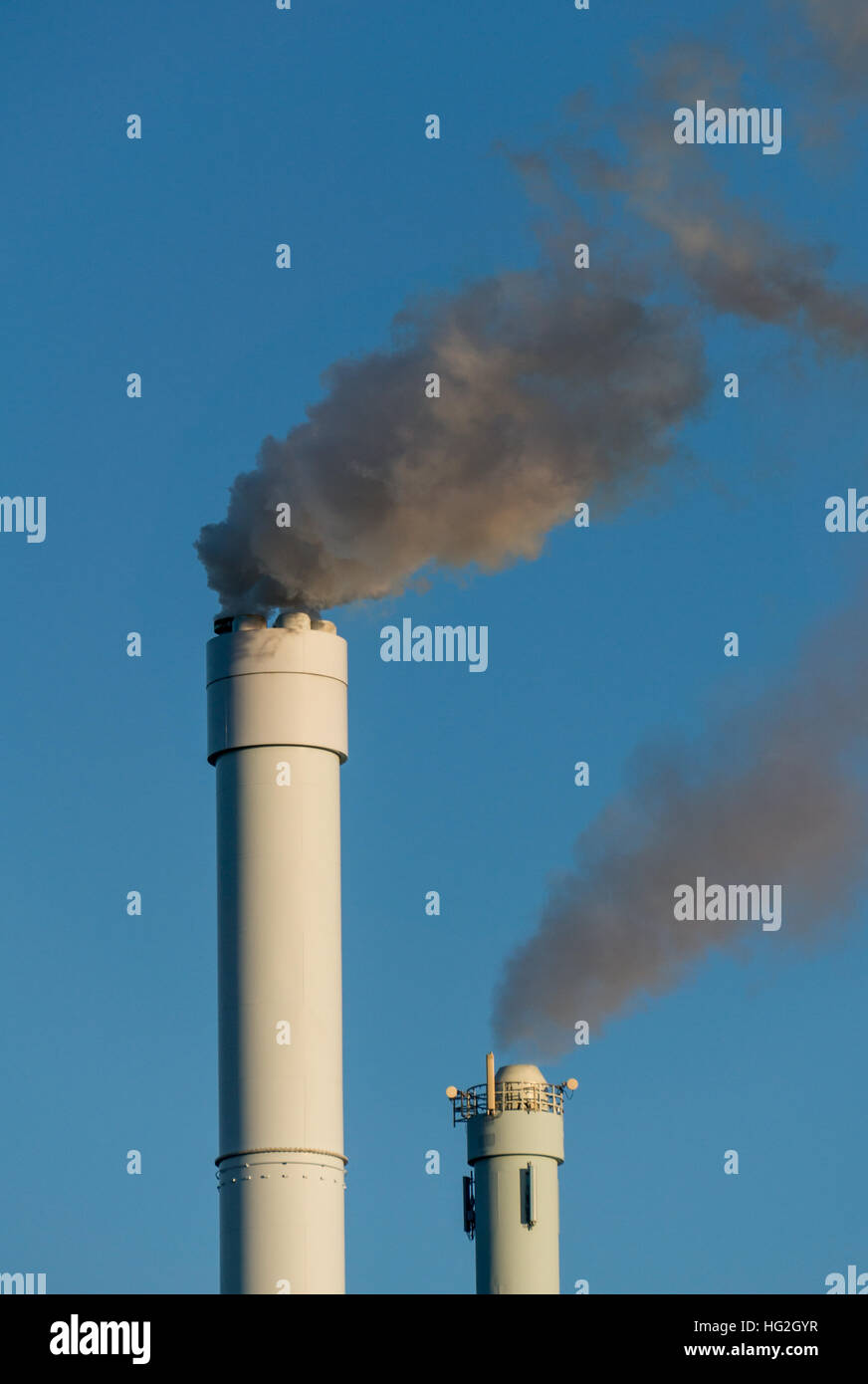 There will be polluted smoke against a clear blue sky from the tall ...