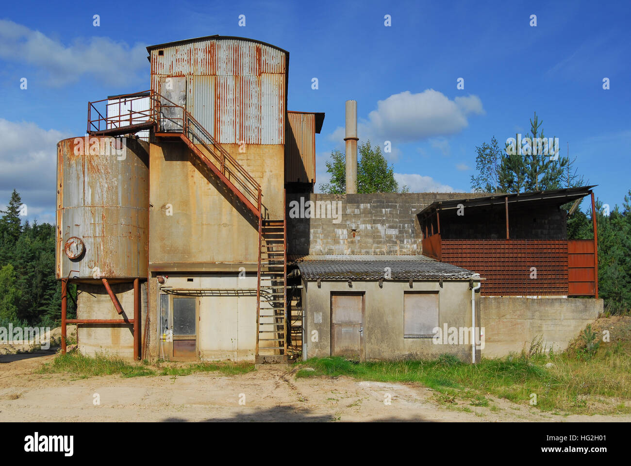 Old abandoned defaulted industrial building which stands with rusty and ...