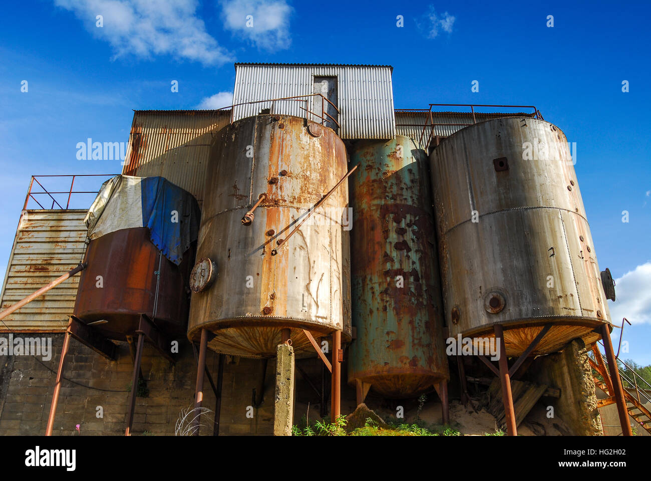 Old abandoned defaulted industrial building which stands with rusty and ...