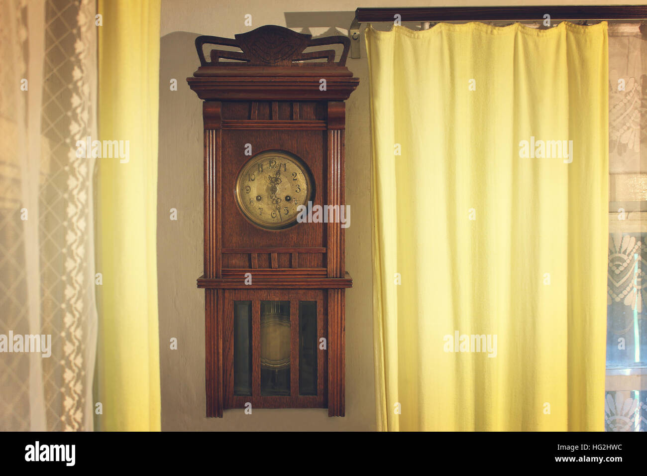The vintage brown wooden wall worn clock Stock Photo - Alamy
