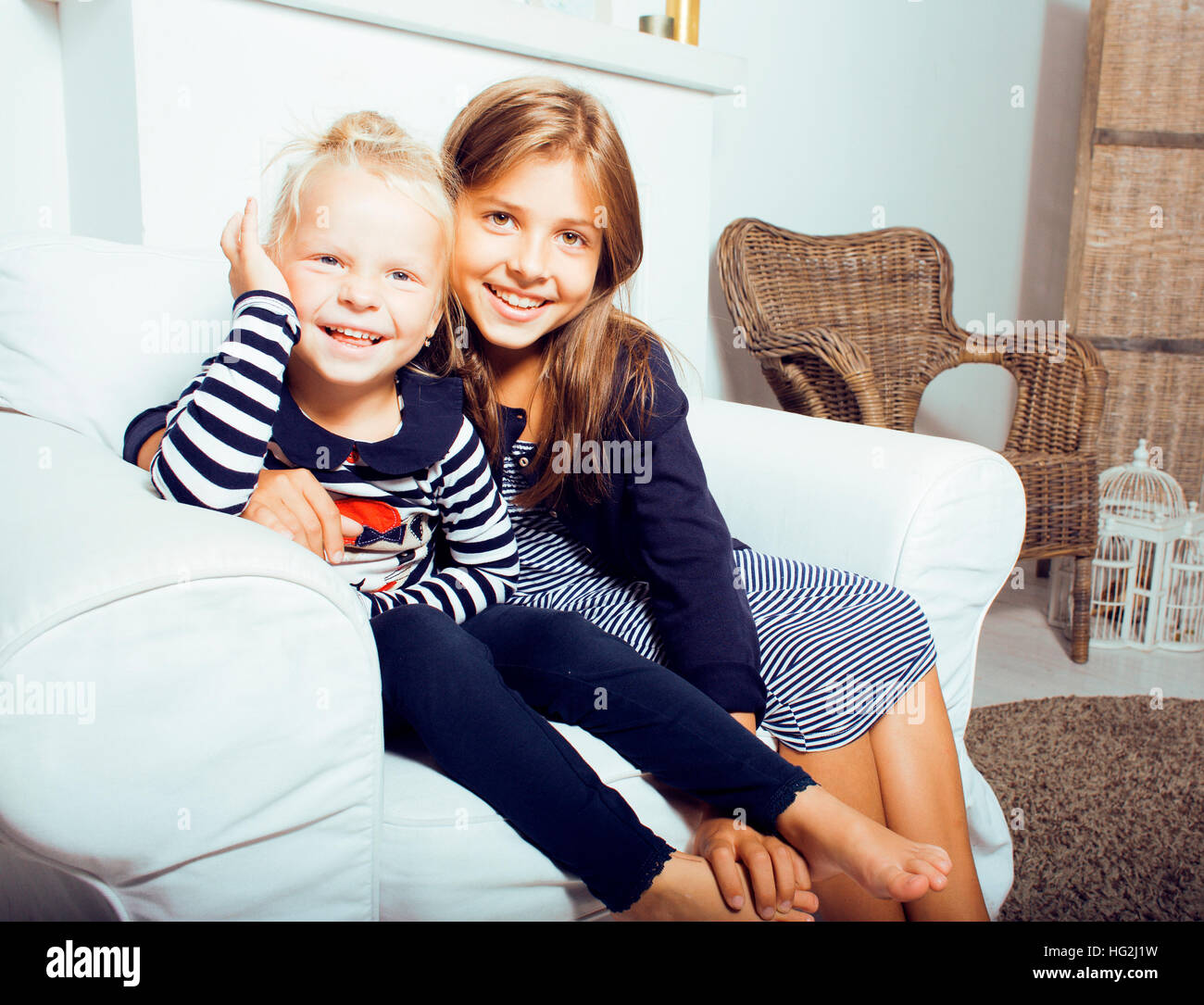 two cute sisters at home interior playing, little happy smiling Stock ...