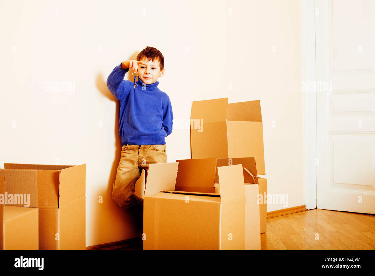 little cute boy in empty room, remoove to new house. home alone ...