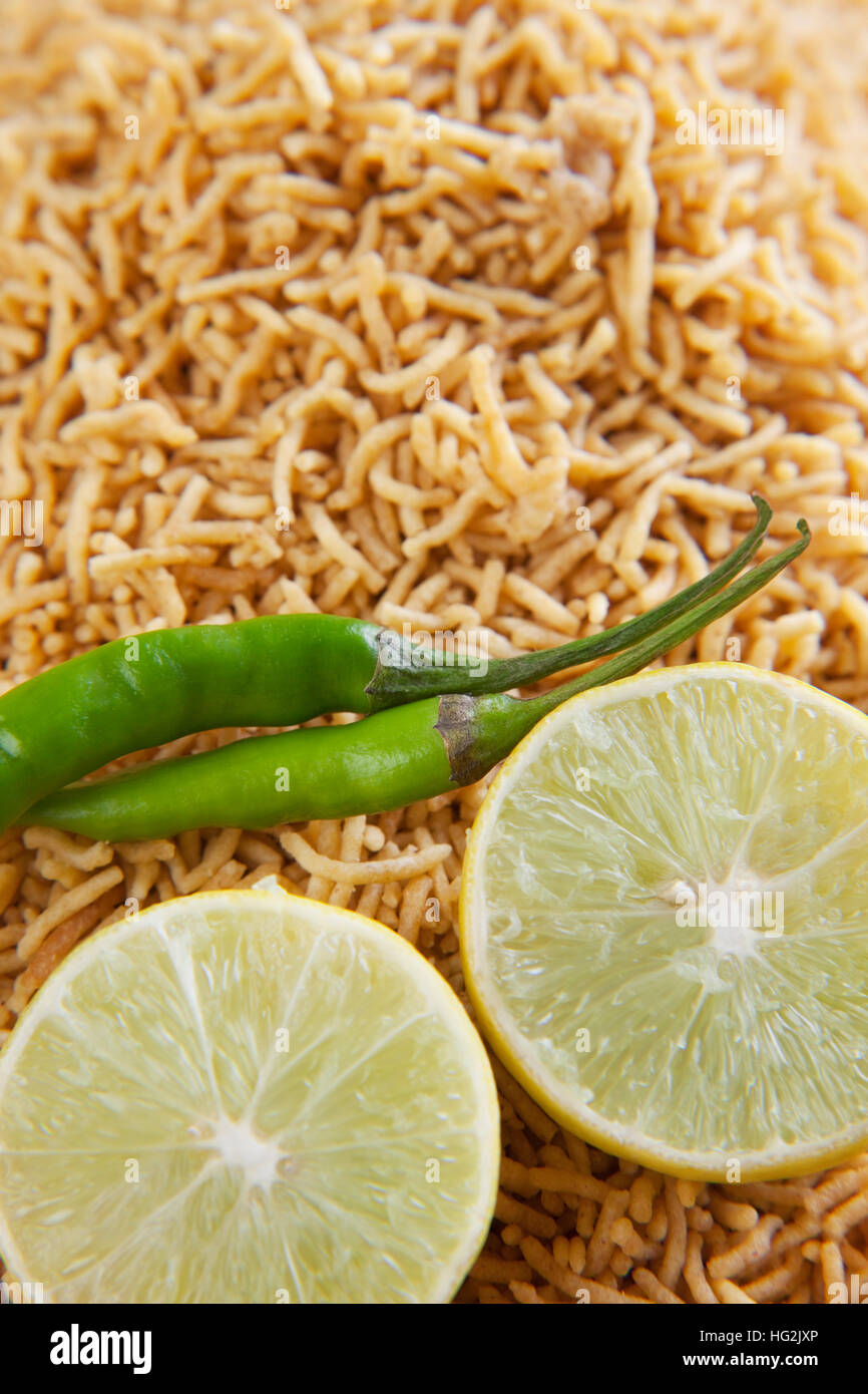 Snacks with lime and green chillies Stock Photo - Alamy