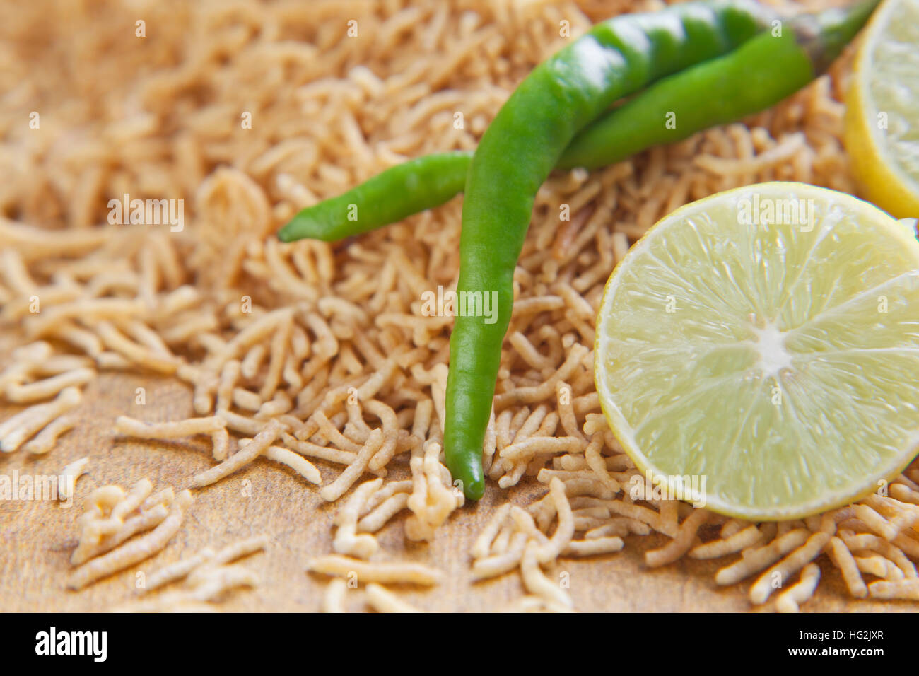 Snacks with lime and green chillies Stock Photo - Alamy