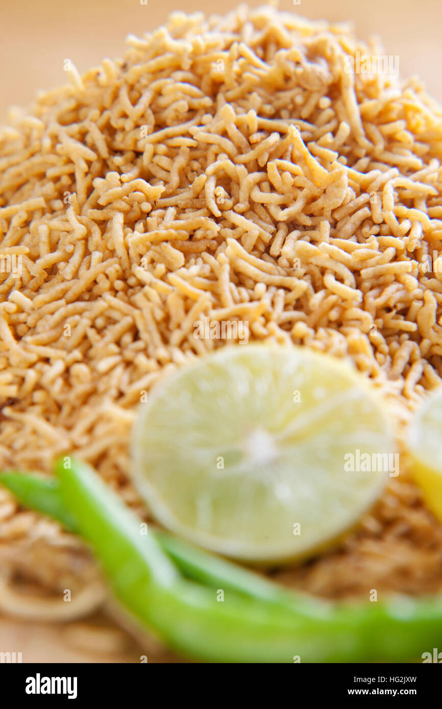 Snacks with lime and green chillies Stock Photo - Alamy