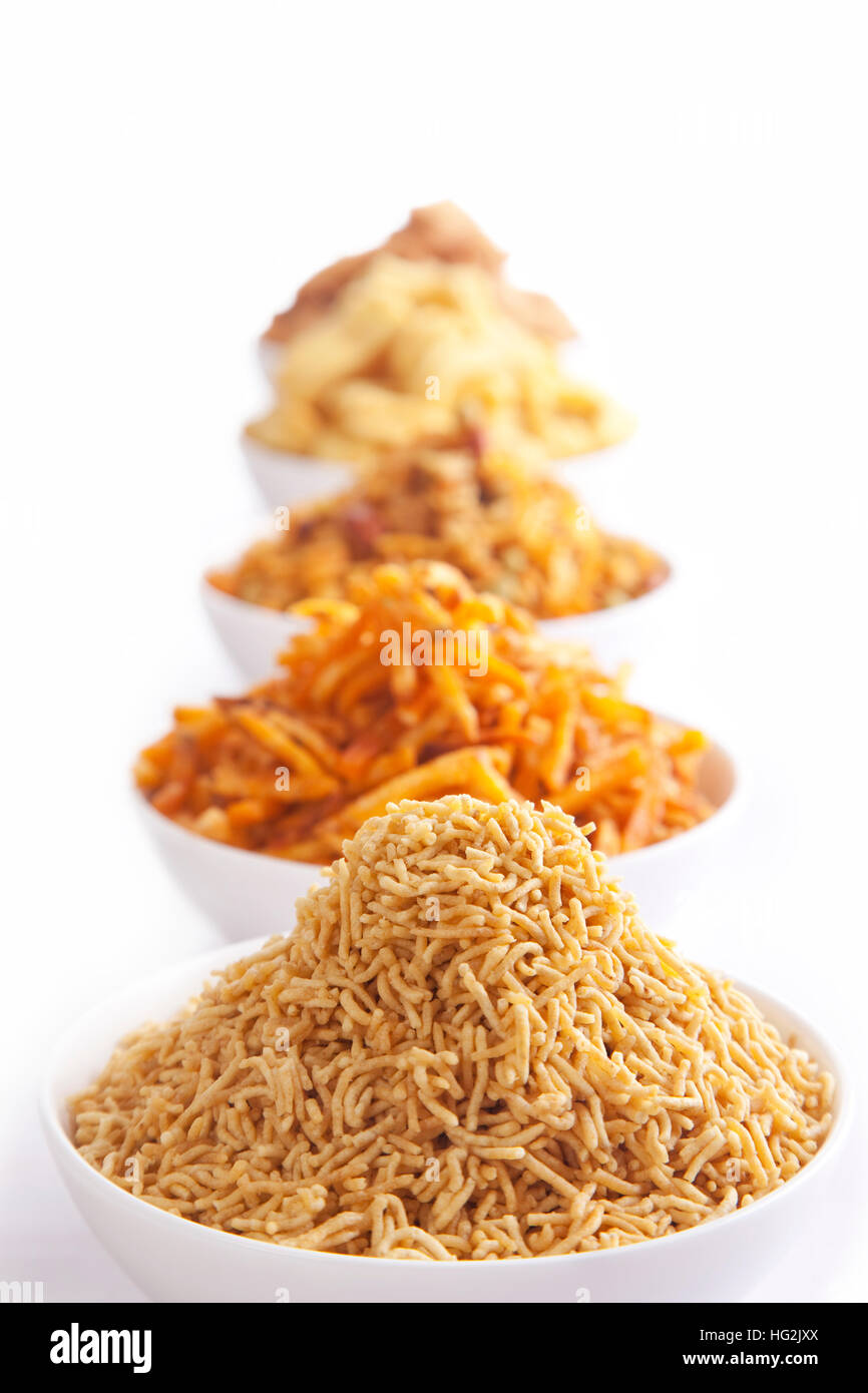 Bowls with fried snacks arranged in a row Stock Photo - Alamy