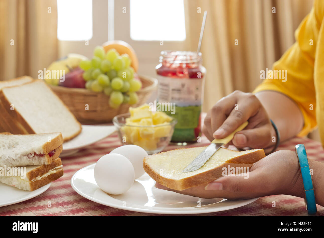 Woman butter bread hi-res stock photography and images - Alamy