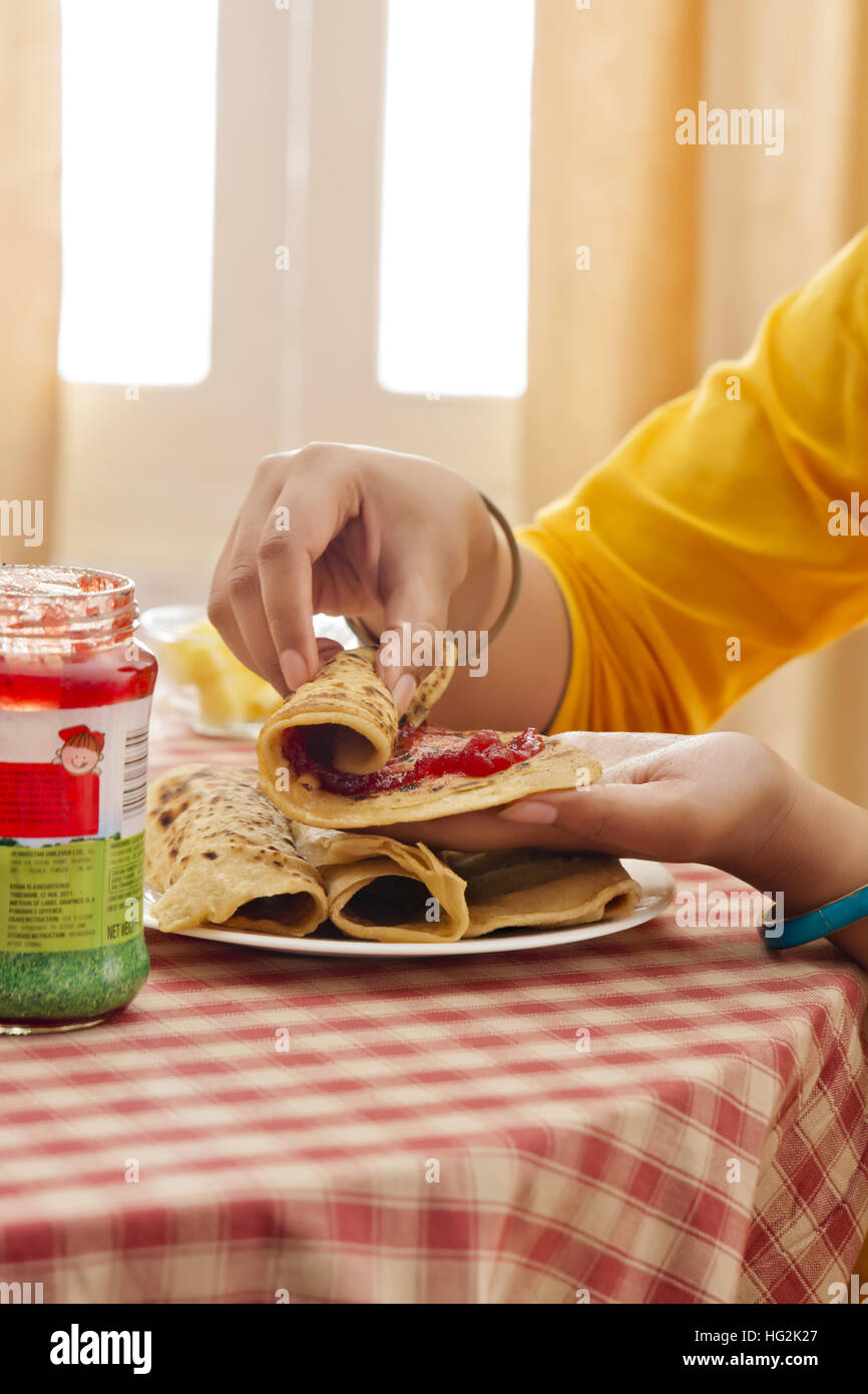 Woman preparing breakfast Stock Photo - Alamy
