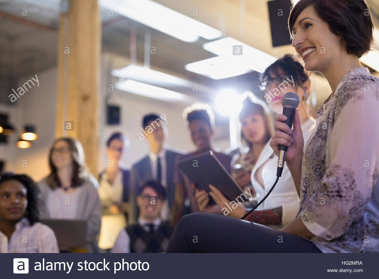 Sitting communication microphone leadership smiling hi-res stock ...