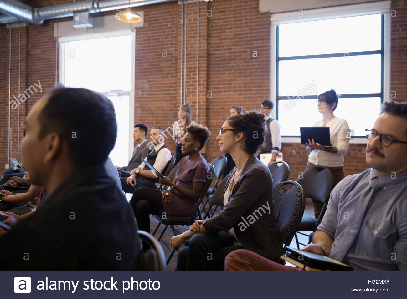 Business people listening in conference room audience Stock Photo - Alamy