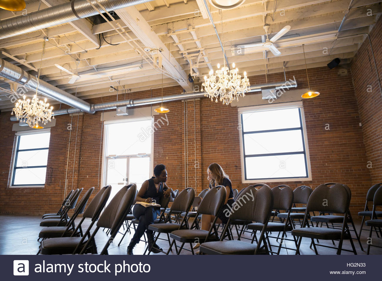 Businesswomen talking in conference room Stock Photo - Alamy